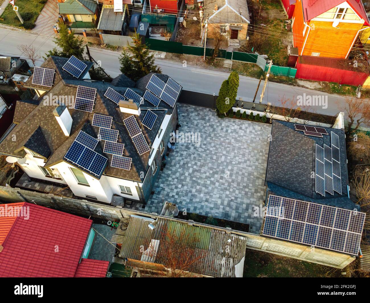 Aerial view of solar photovoltaic panels on a own house roof in small ...