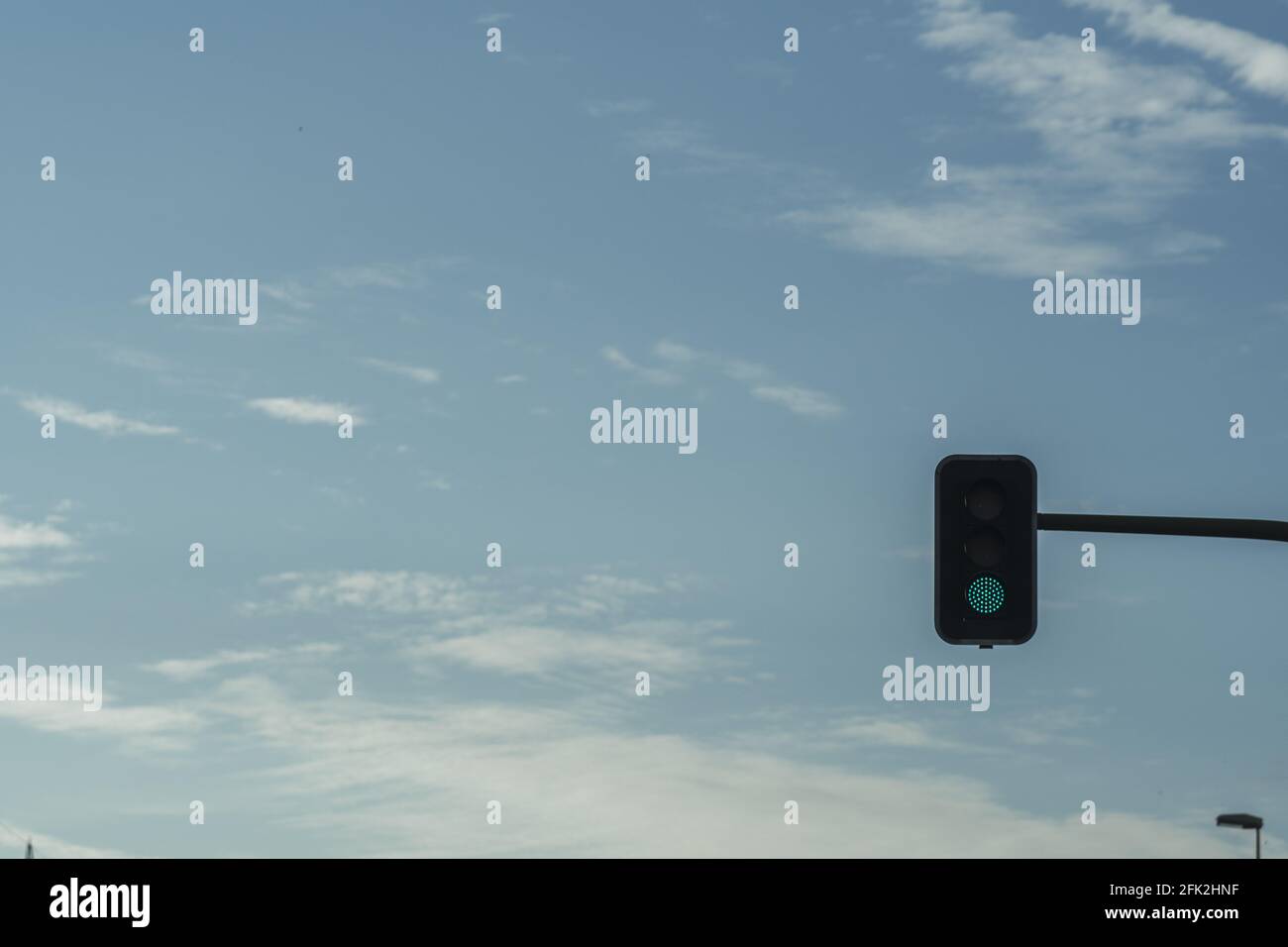 Low angle shot of a traffic light with an illuminated green light Stock ...