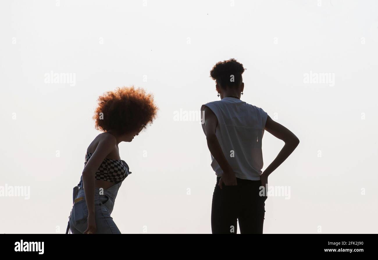 Two friends relaxing Stock Photo - Alamy