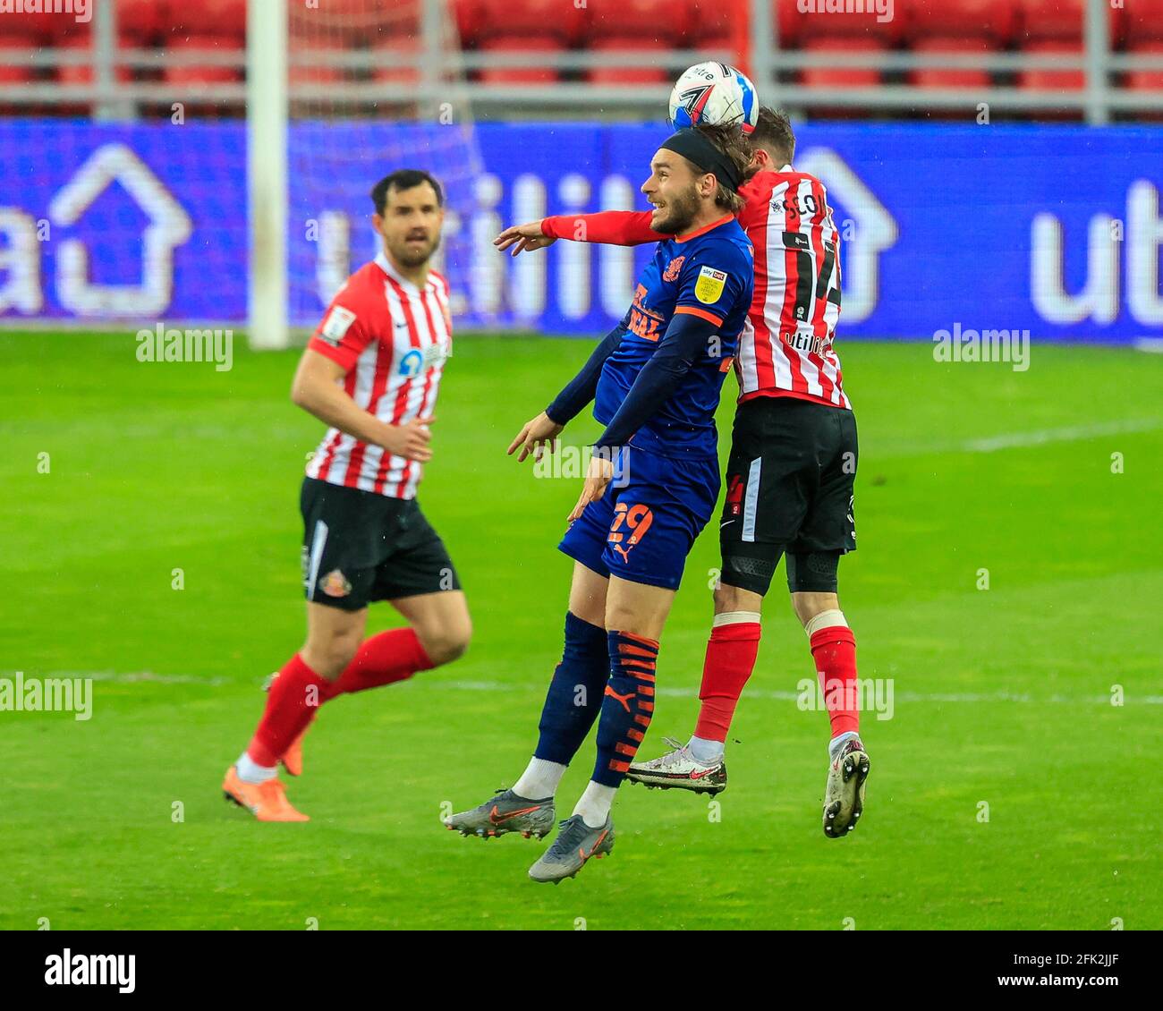 Josh Scowen #14 of Sunderland in an aerial challenge with Luke Garbutt ...