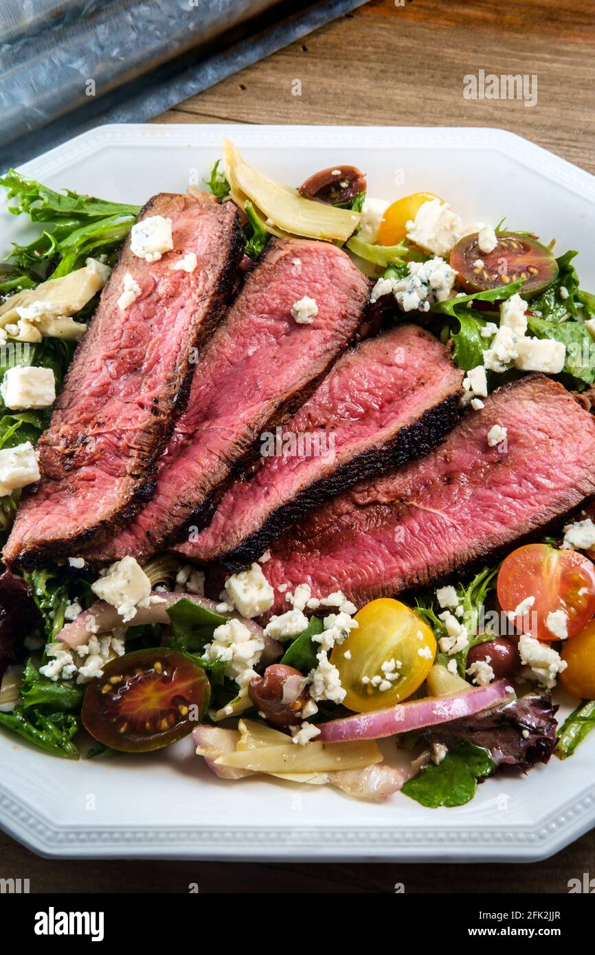 Blue cheese steak salad cooked rare with kalamata olives and artichoke ...