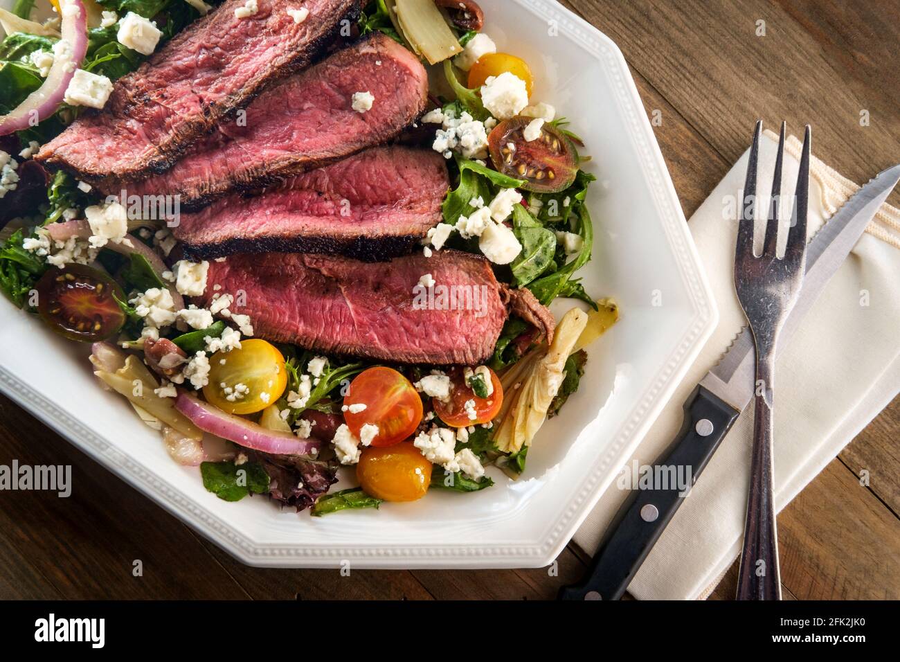 Blue cheese steak salad cooked rare with kalamata olives and artichoke ...