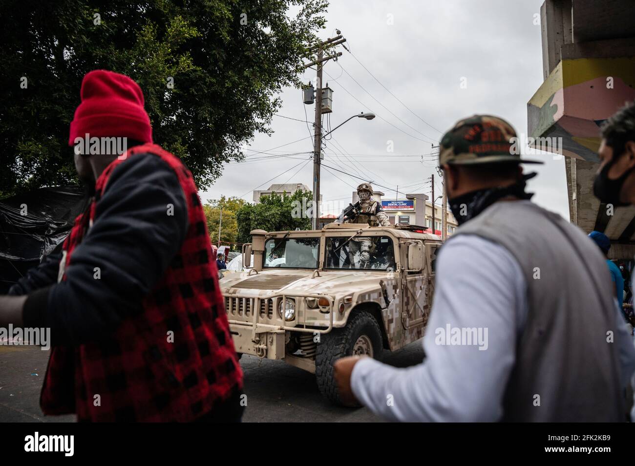 Tijuana, Mexico. 14th Apr, 2021. Armed Mexican national guardsmen drive ...