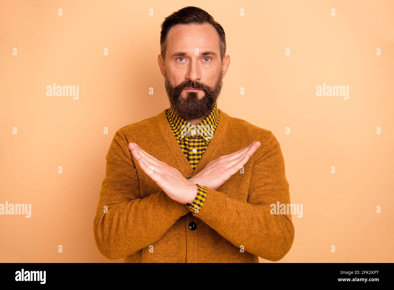 Photo of concentrated person crossed arms show reject symbol look ...