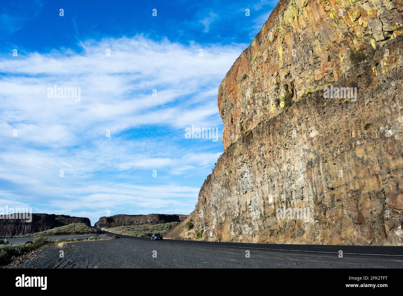 Scenic desert road running along basalt rock formations near Grand ...