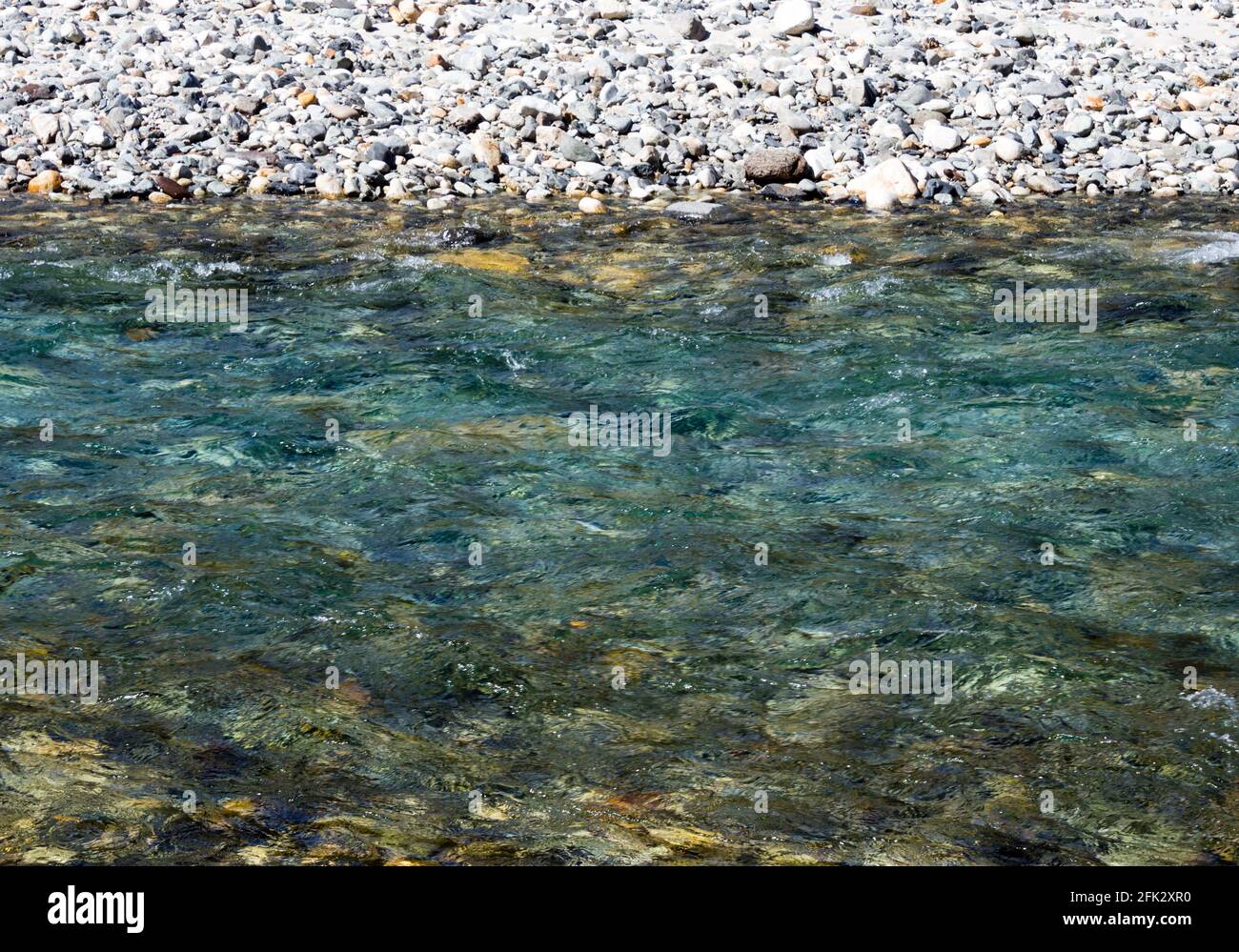 Beautiful alpine creek with clear blue water in Kamikochi valley ...
