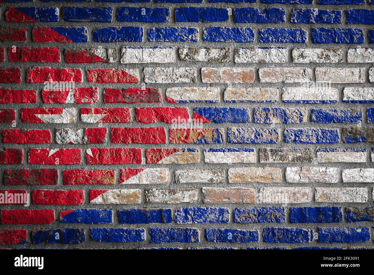 National flag of Cuba depicting in paint colors on an old brick wall ...