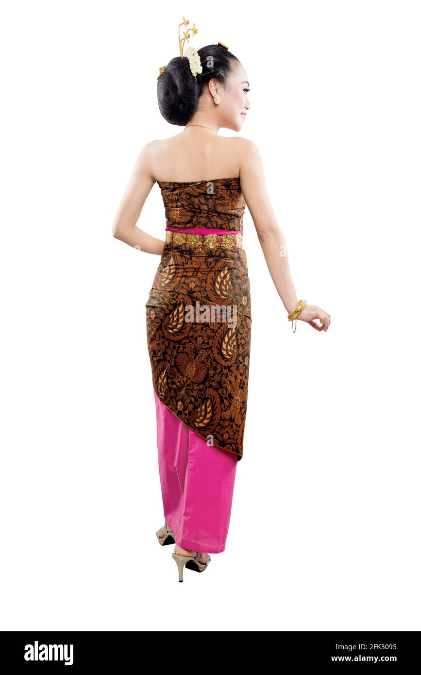 Rear view of Asian woman with Java traditional dance costume standing ...