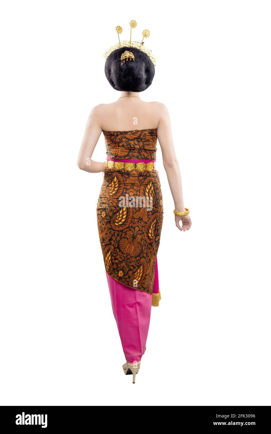 Rear view of Asian woman with Java traditional dance costume standing ...