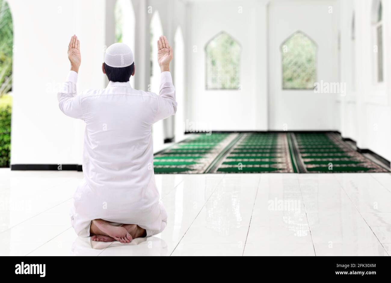 Rear view man praying on hi-res stock photography and images - Alamy