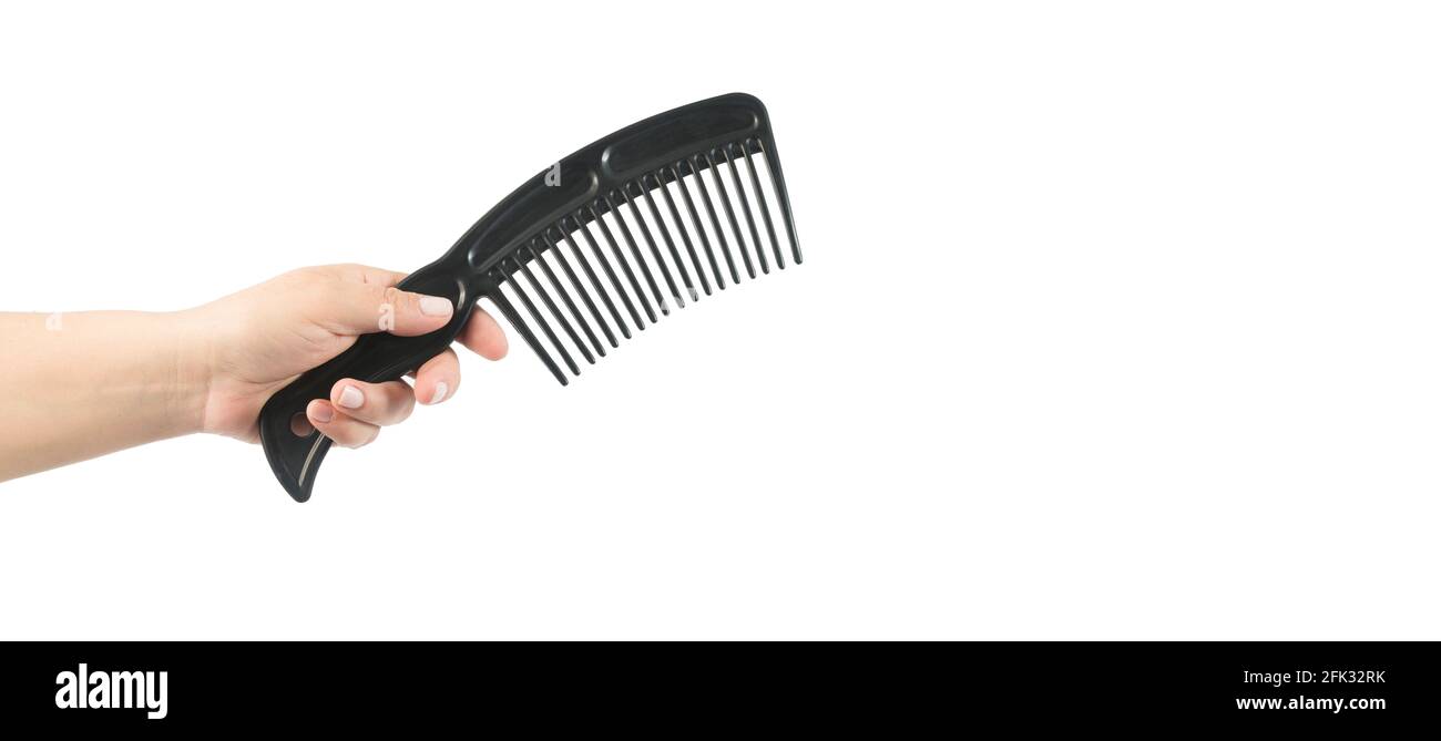 woman's hand holding hair comb, isolated on white background, space for ...
