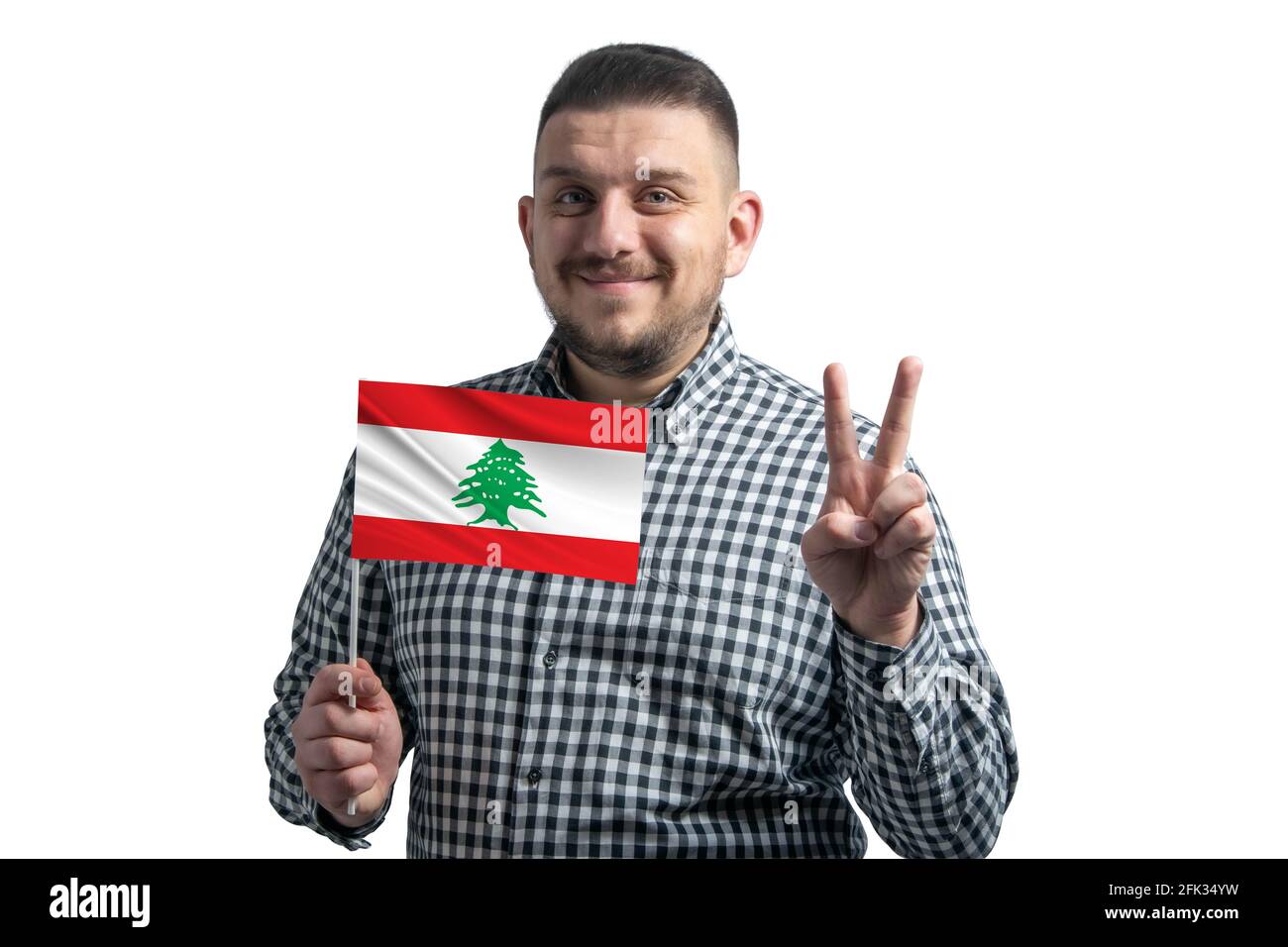 White guy holding a flag of Lebanon and shows two fingers isolated on a ...