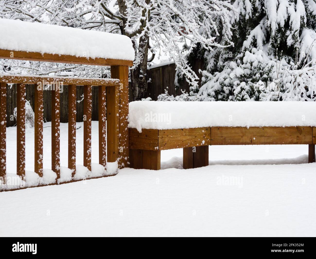 Snow covered wooden deck and backyard Stock Photo - Alamy