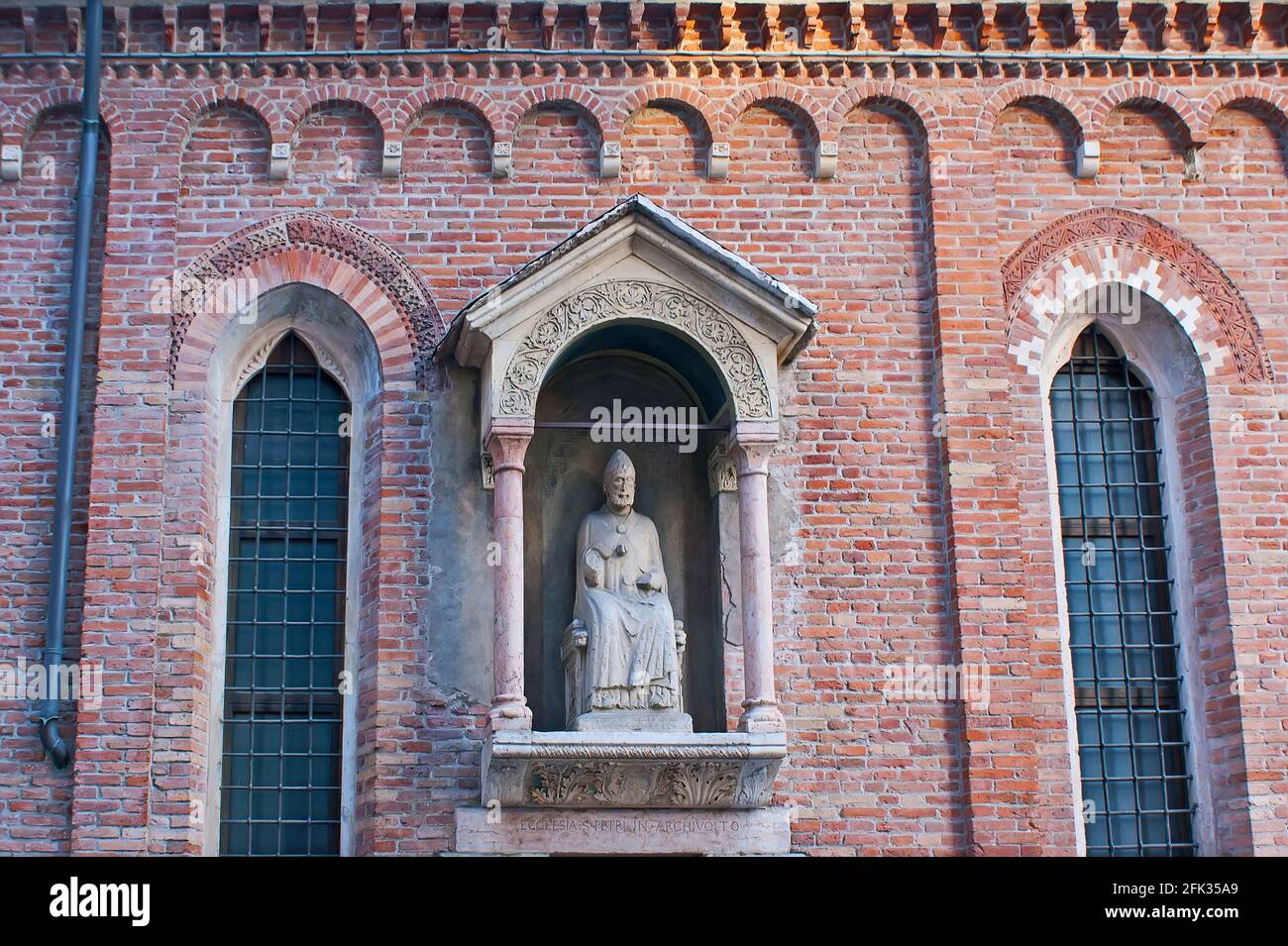 The medieval marble aedicula (small shrine) of St Peter on the facade ...