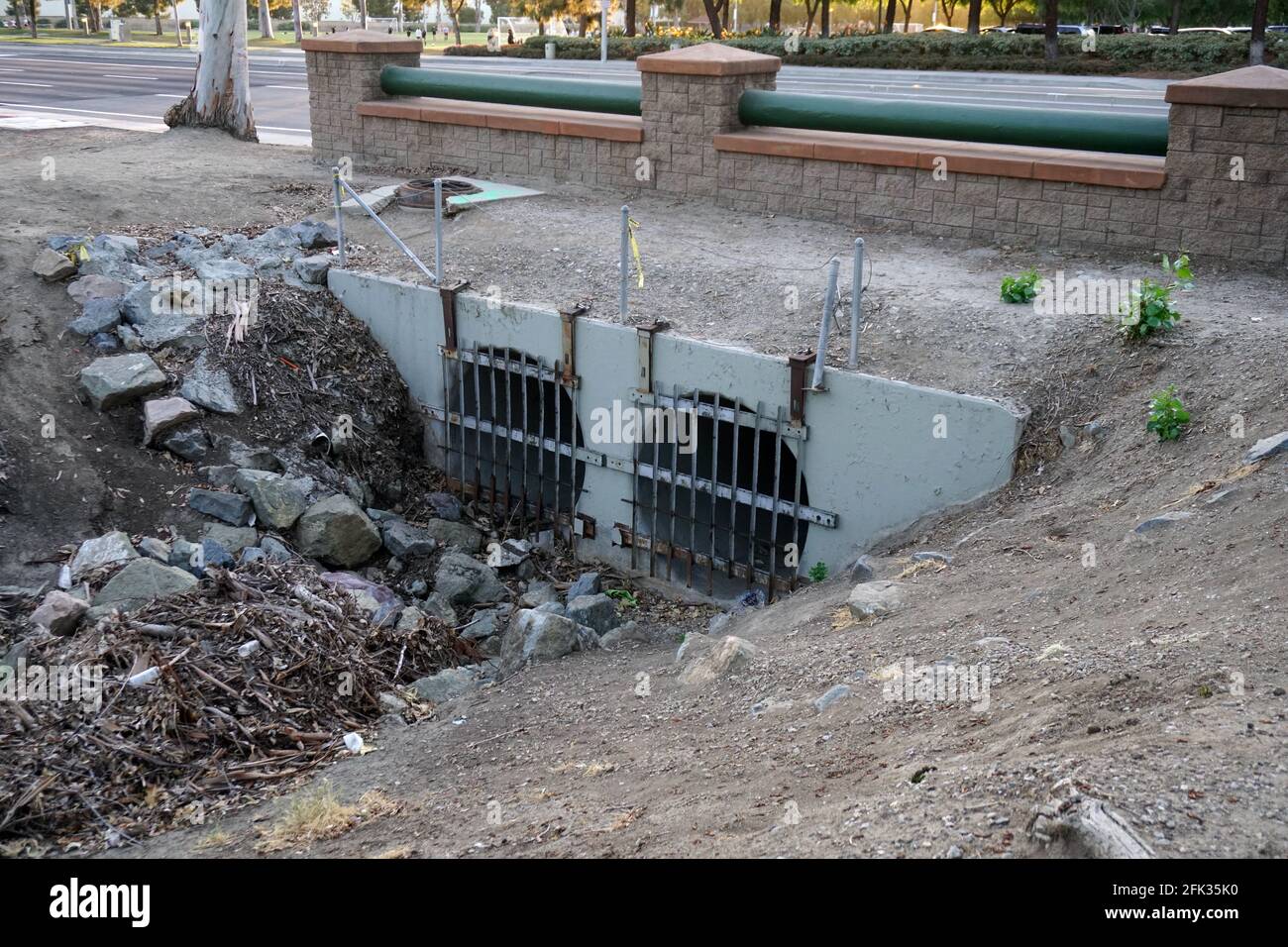 Storm drain culverts with debris grating Stock Photo - Alamy