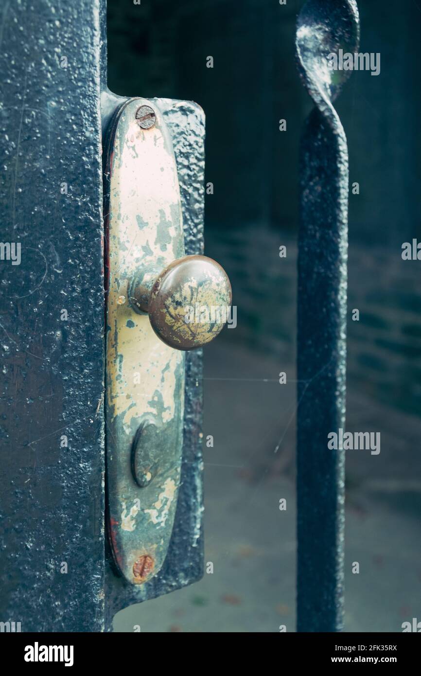 Vertical closeup shot of an old and rustic knob of a steel gate Stock ...