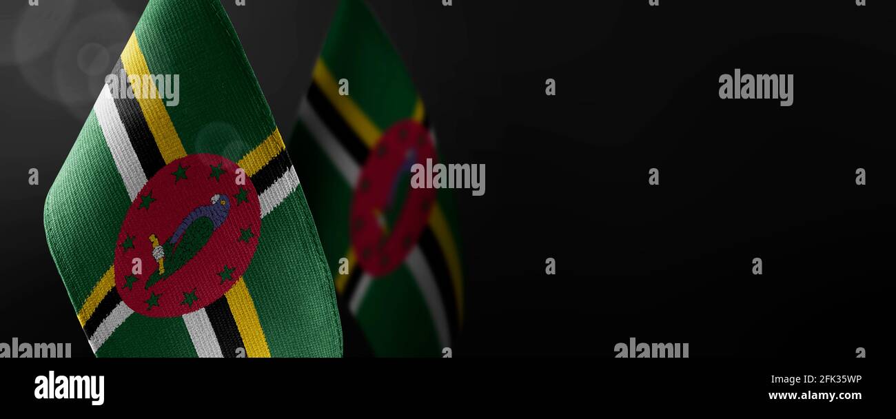 Small national flags of the Dominica on a dark background Stock Photo ...