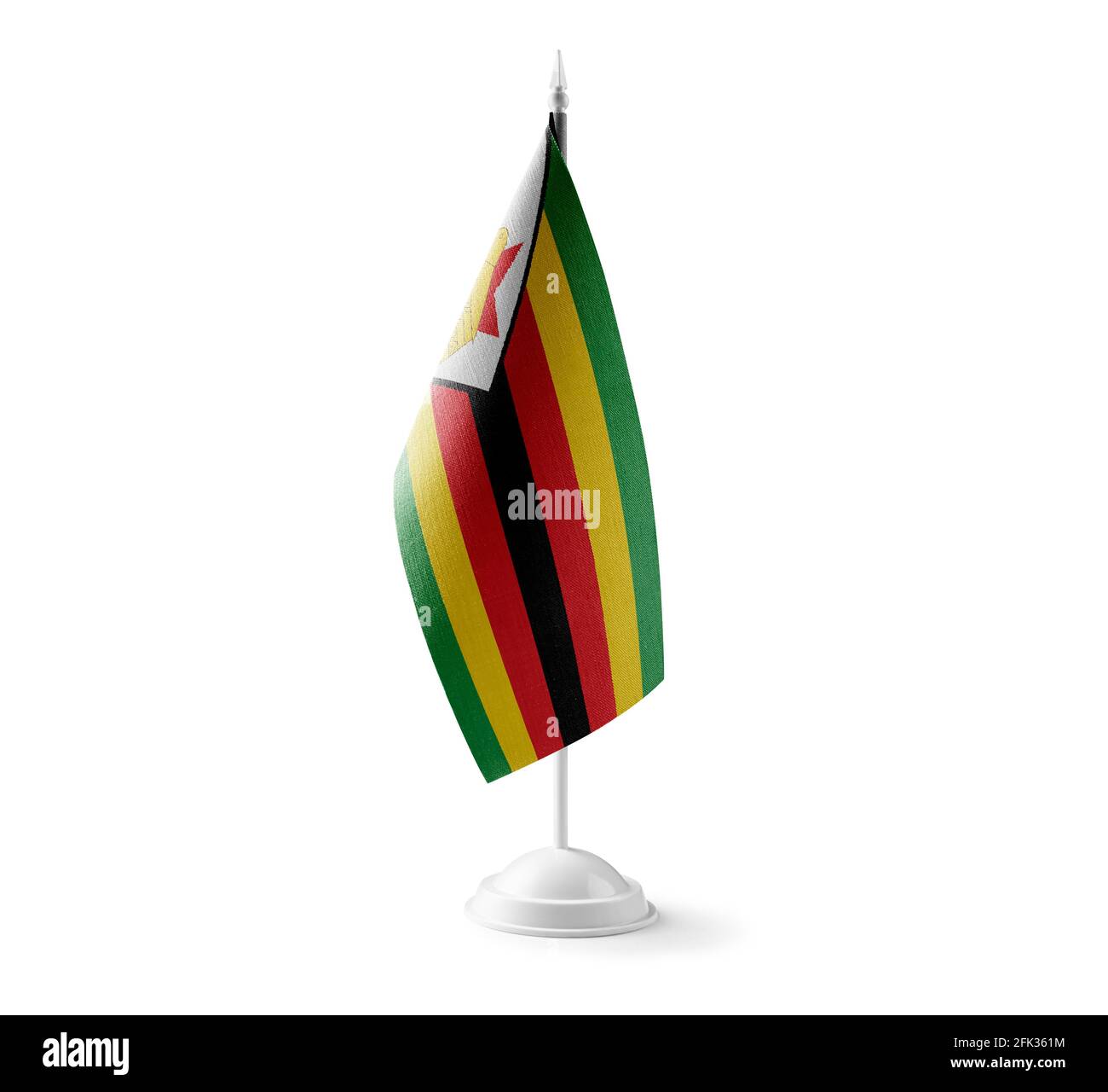 Small national flag of the Zimbabwe on a white background Stock Photo ...