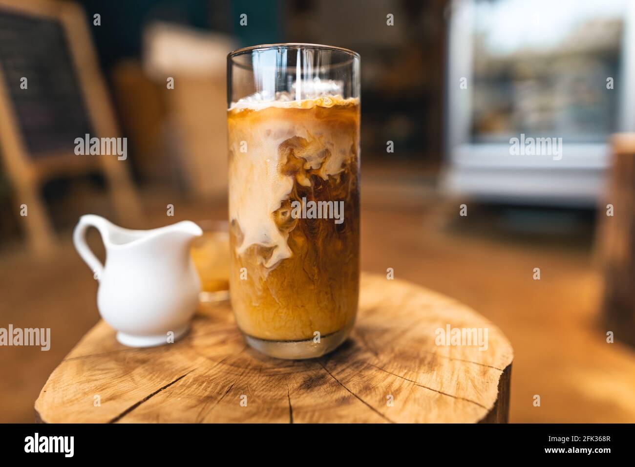 Iced coffee with milk in a cup Stock Photo - Alamy