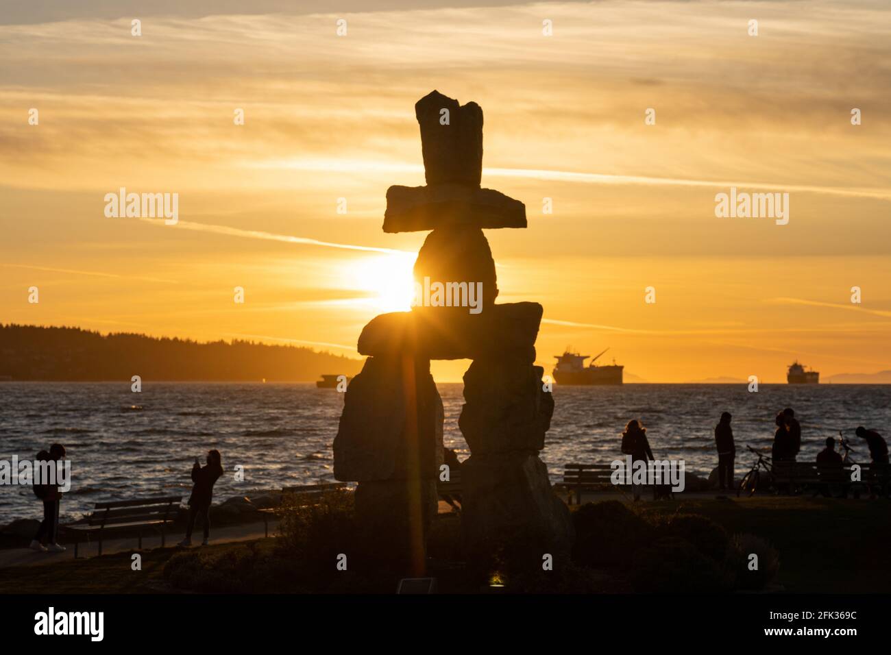 Inukshuk stone sculpture in the sunset time at English Bay Beach ...