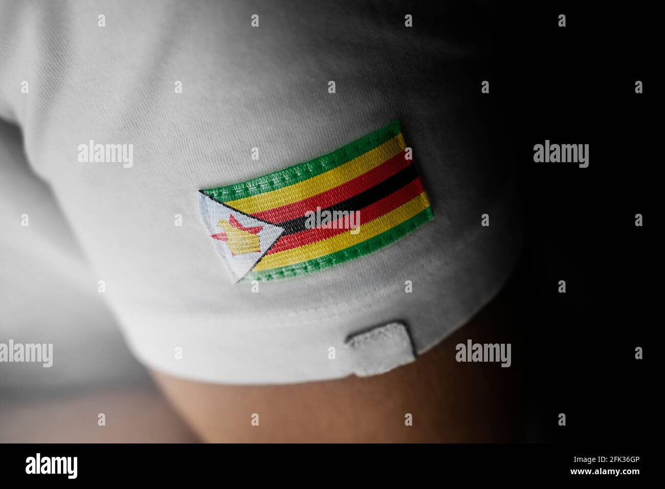 Patch of the national flag of the Zimbabwe on a white t-shirt Stock ...