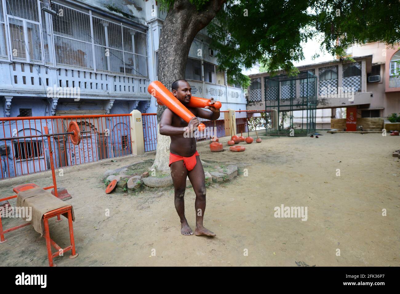 An Indian pehlwan exercising with Indian clubs in Varansai, Uttar ...