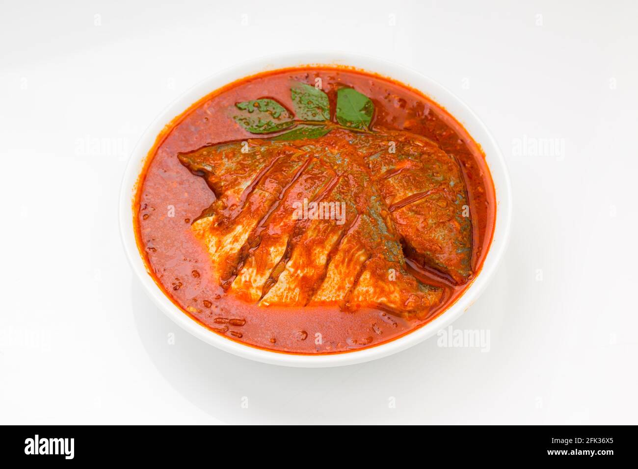 White pomfret masala curry , made in south indian style with thick red ...