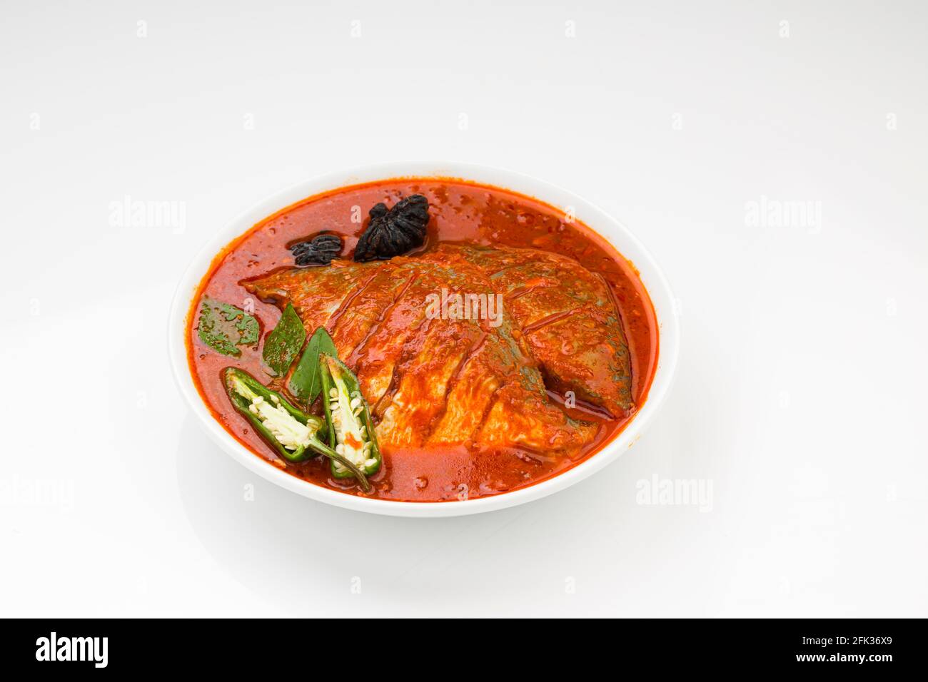 White pomfret masala curry , made in south indian style with thick red ...