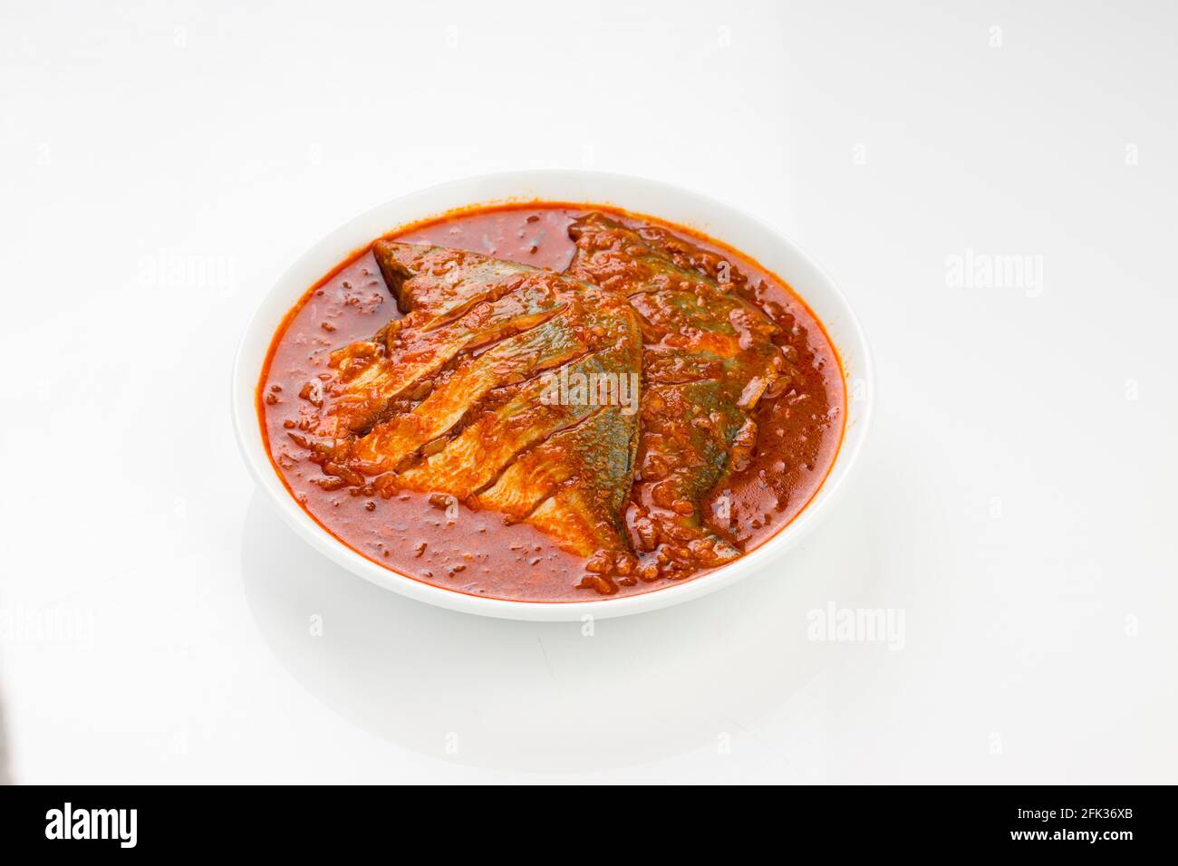 White pomfret masala curry , made in south indian style with thick red ...