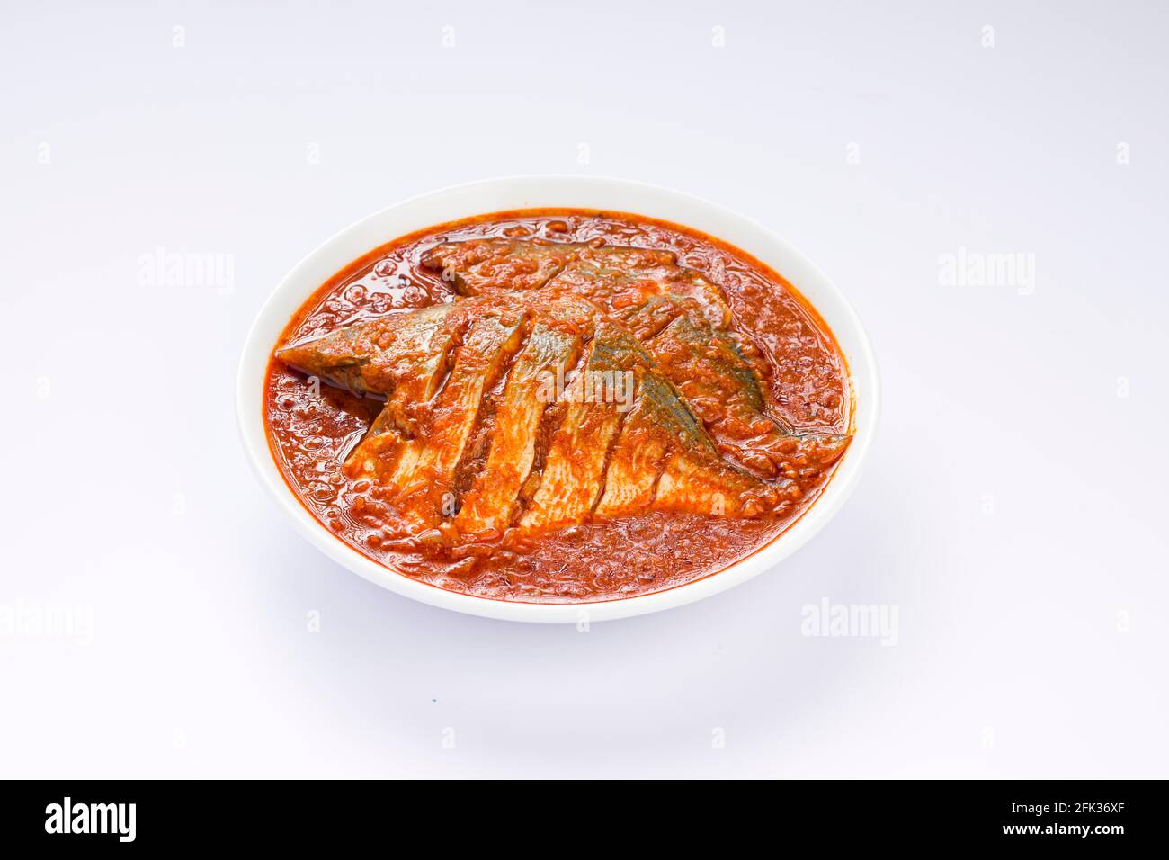 White pomfret masala curry , made in south indian style with thick red ...