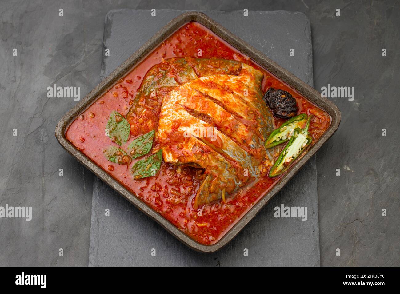 White pomfret masala curry , made in south indian style with thick red ...