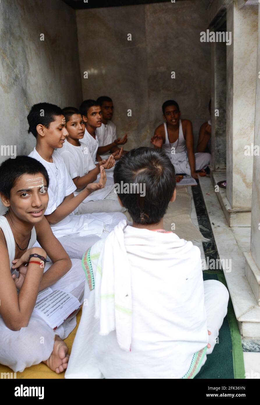 Brahmin Boys studying a holy text in a small temple in the old city of ...