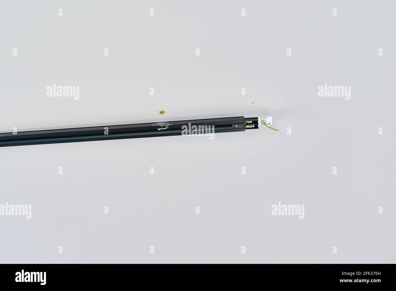 Installation of LED ceiling mounted modern track downlight Stock Photo ...