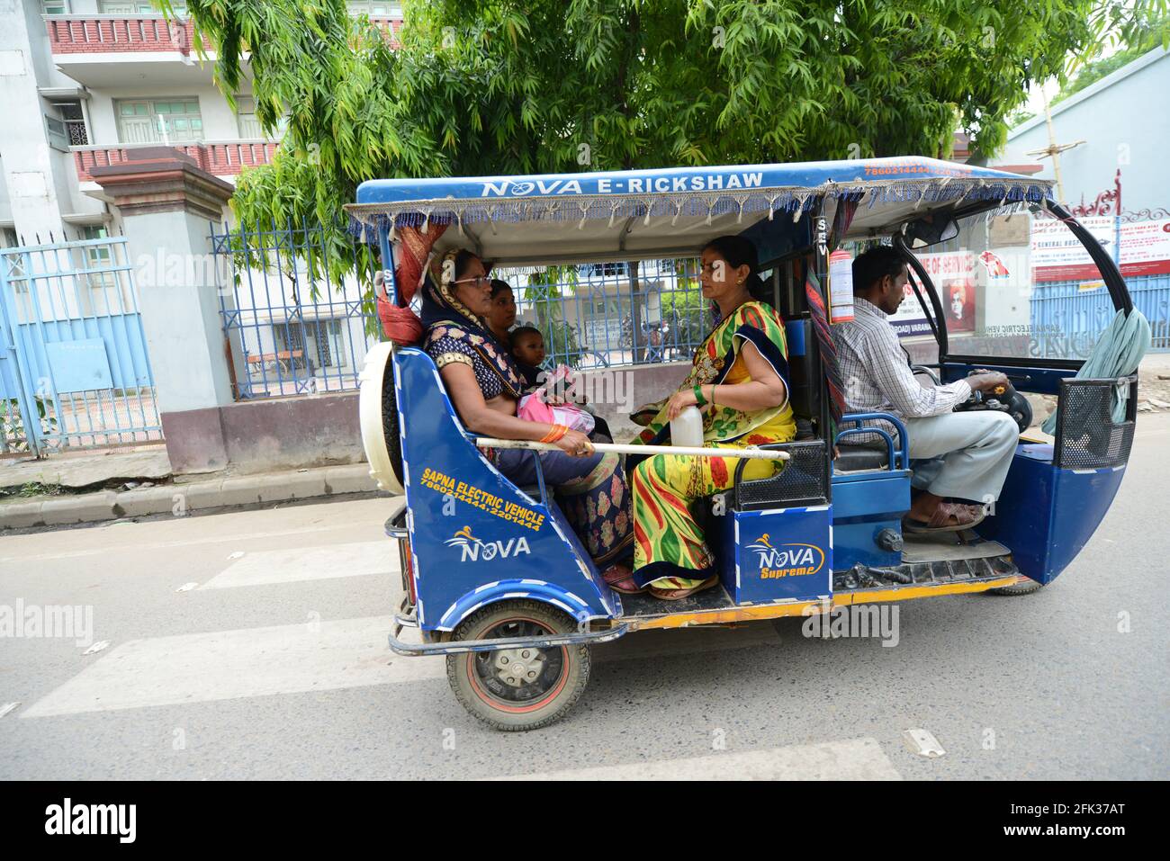 Indian women riding in an Auto Rickshaw in Varanasi, India Stock Photo ...