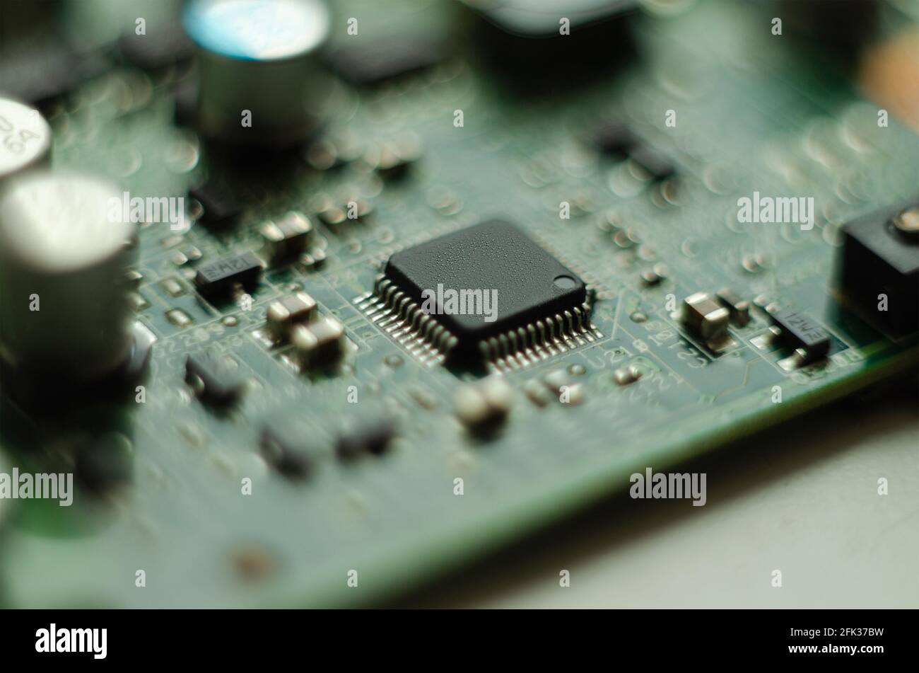 circuit board green with a microcontroller, microprocessor control chip ...