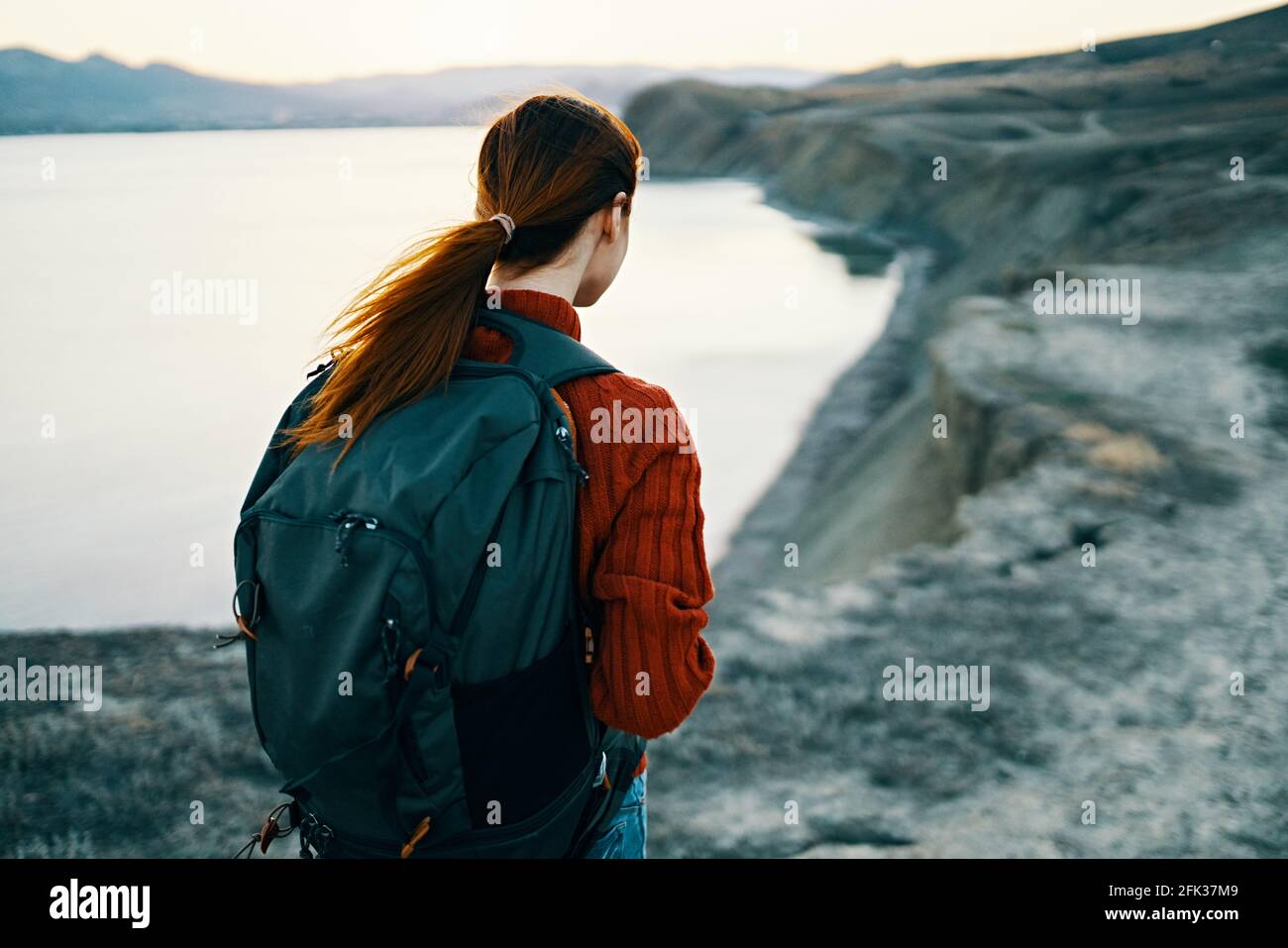 travel tourism woman outdoors in the mountains landscape sunset sea ...