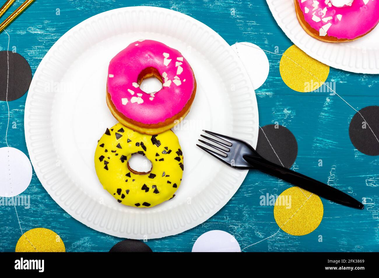 A plate of donuts. Donuts in colored glaze. Sweet donuts Stock Photo ...