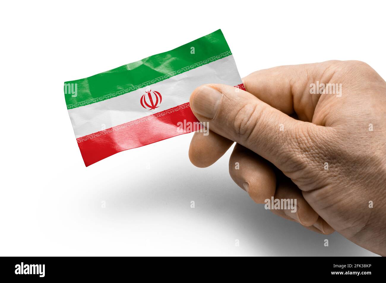 Hand holding a card with a national flag the Iran Stock Photo - Alamy