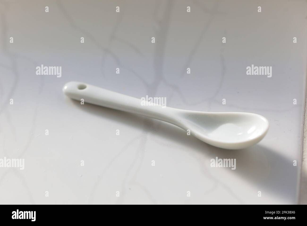 Close-up of a White Ceramic /China Spoon Stock Photo - Alamy
