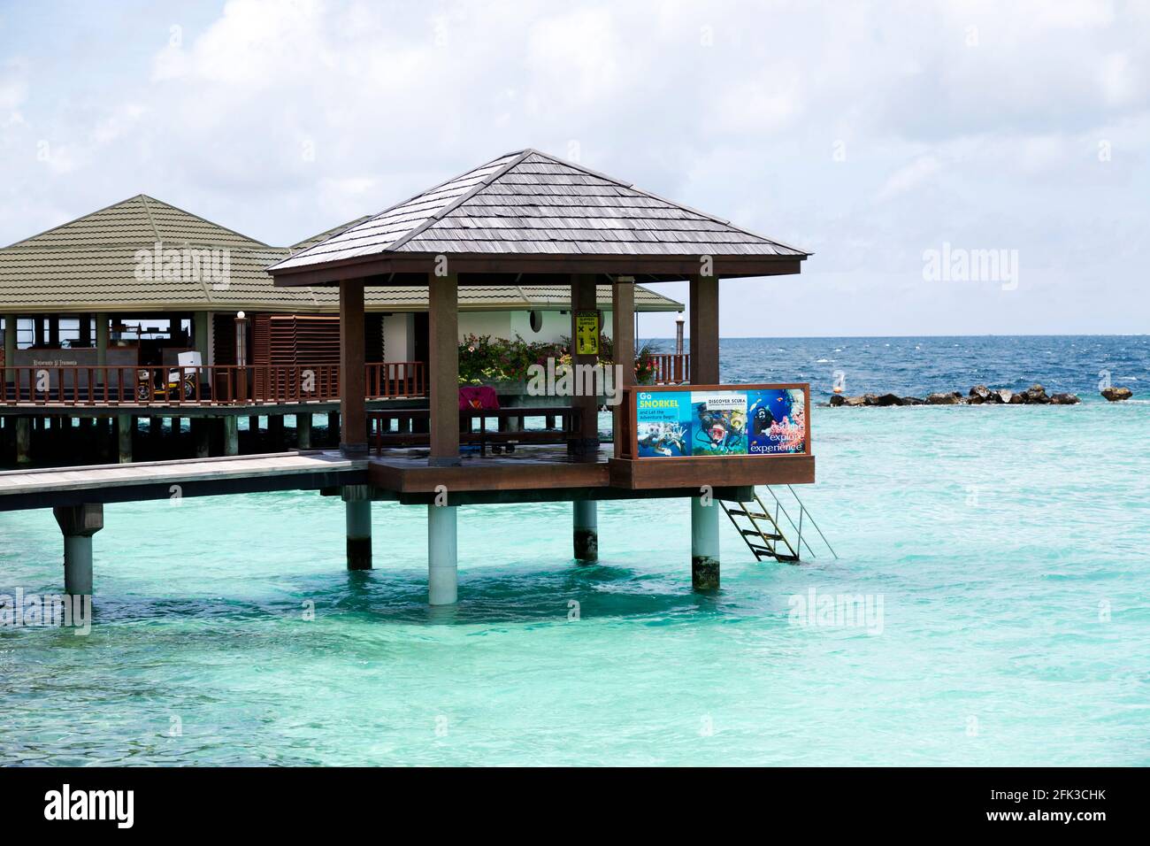 Over-water platform at Paradise Island in the Maldives. The open-sided ...