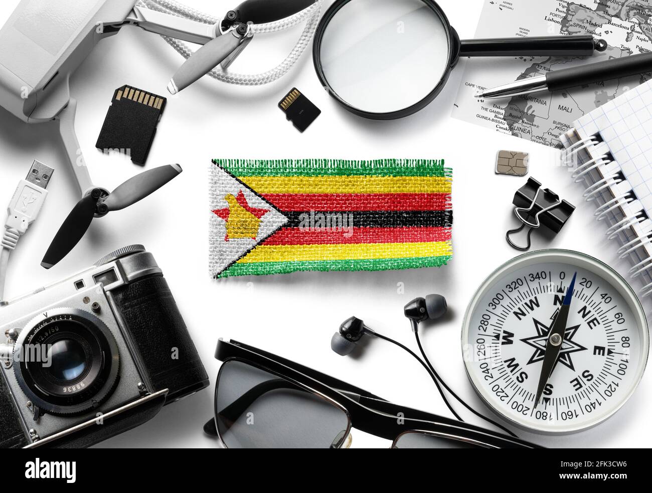 Flag of Zimbabwe and travel accessories on a white background Stock ...