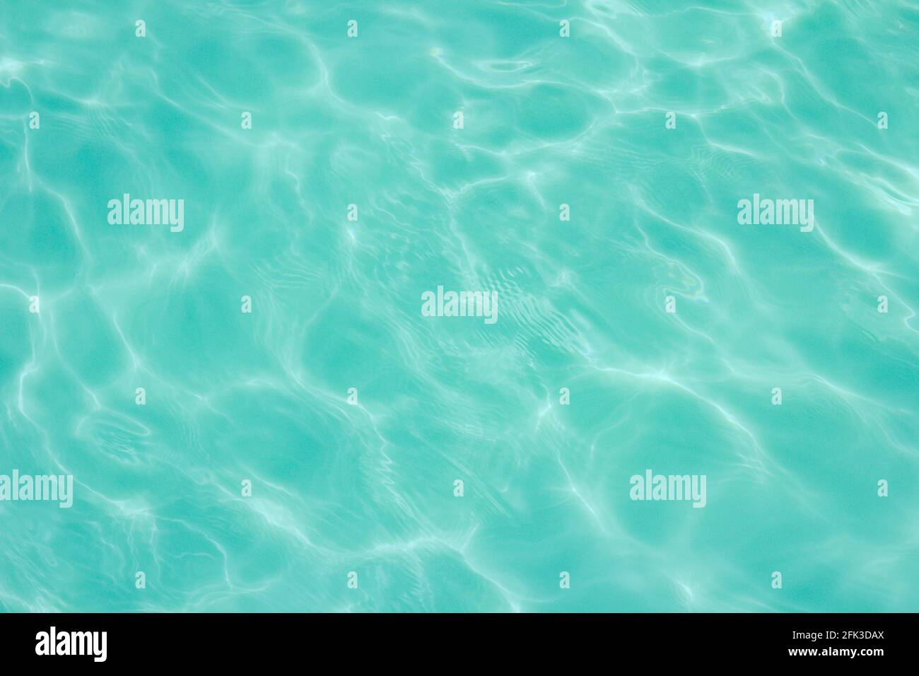 swimming pool with sunny reflections background Stock Photo - Alamy