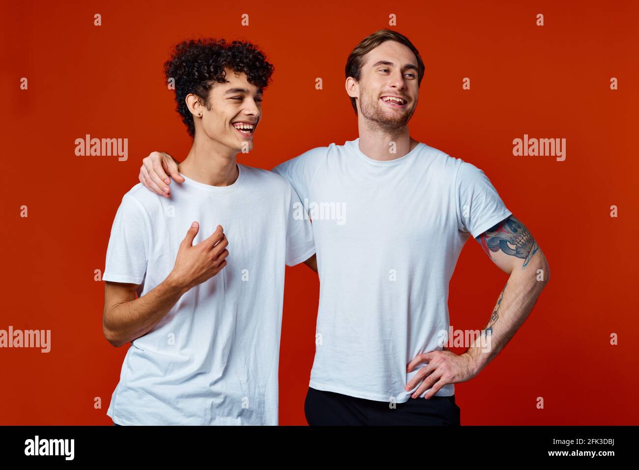 two men hugging friendship communication lifestyle fun Stock Photo - Alamy