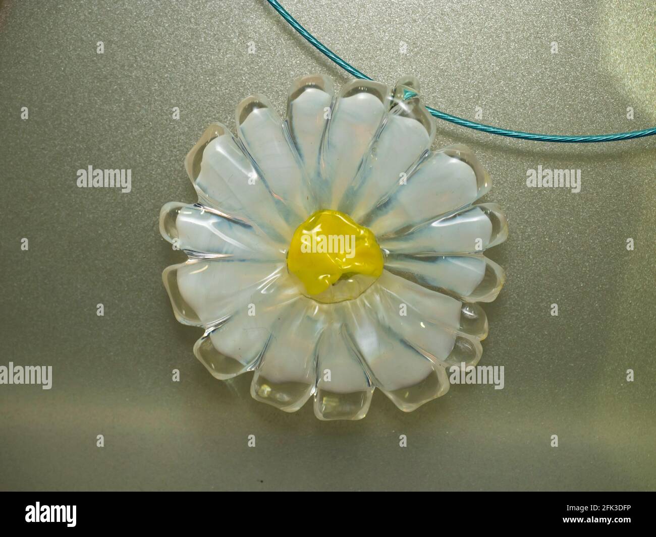 Glass pendant in the shape of a daisy. A beautiful art object made by ...
