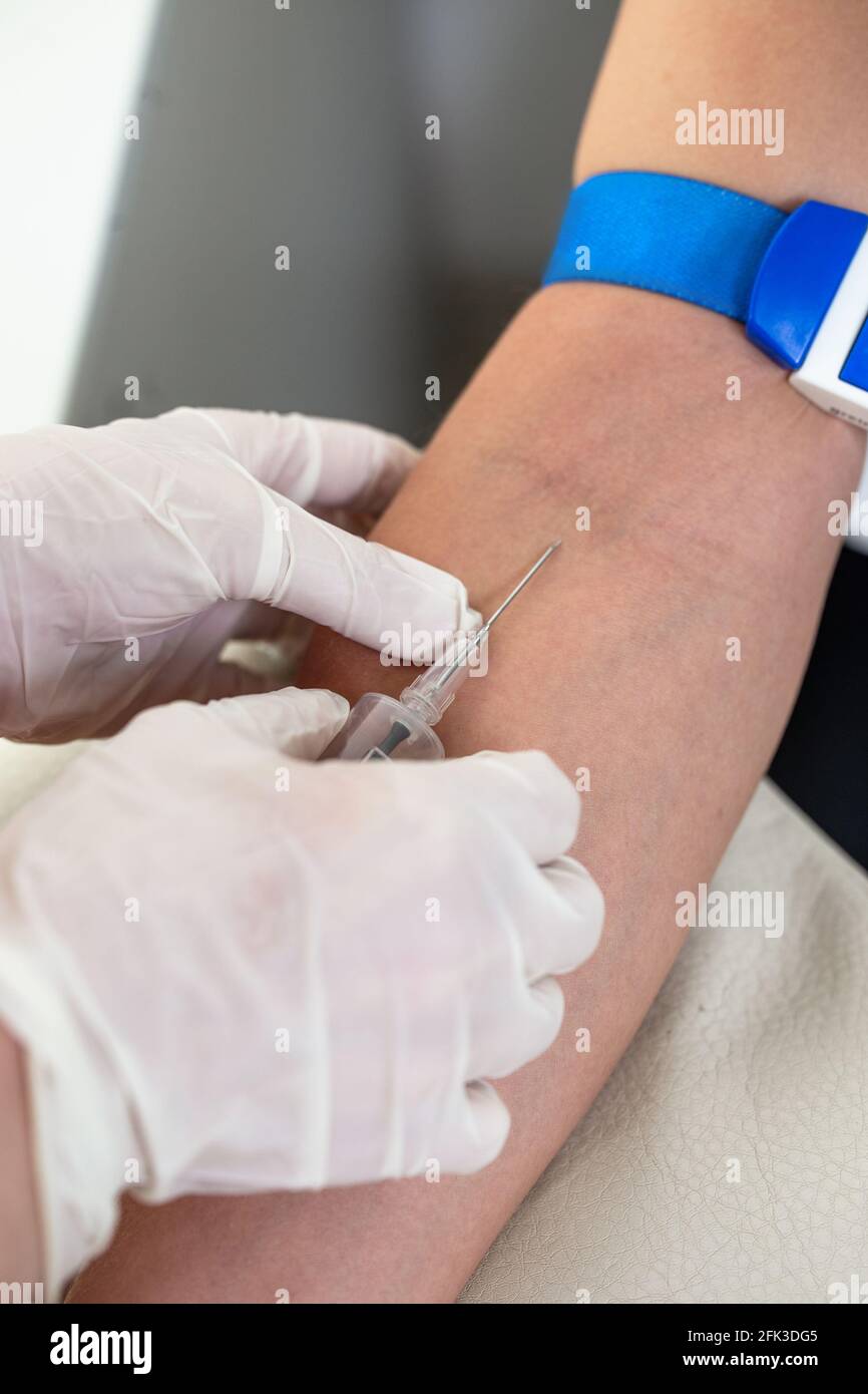 Iv tubing in arm hi-res stock photography and images - Alamy