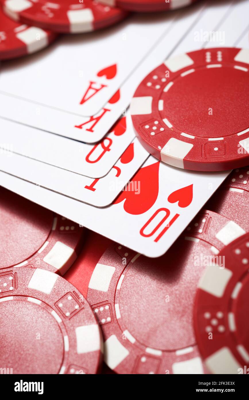 View of a gaming table with royal flush cards Stock Photo - Alamy
