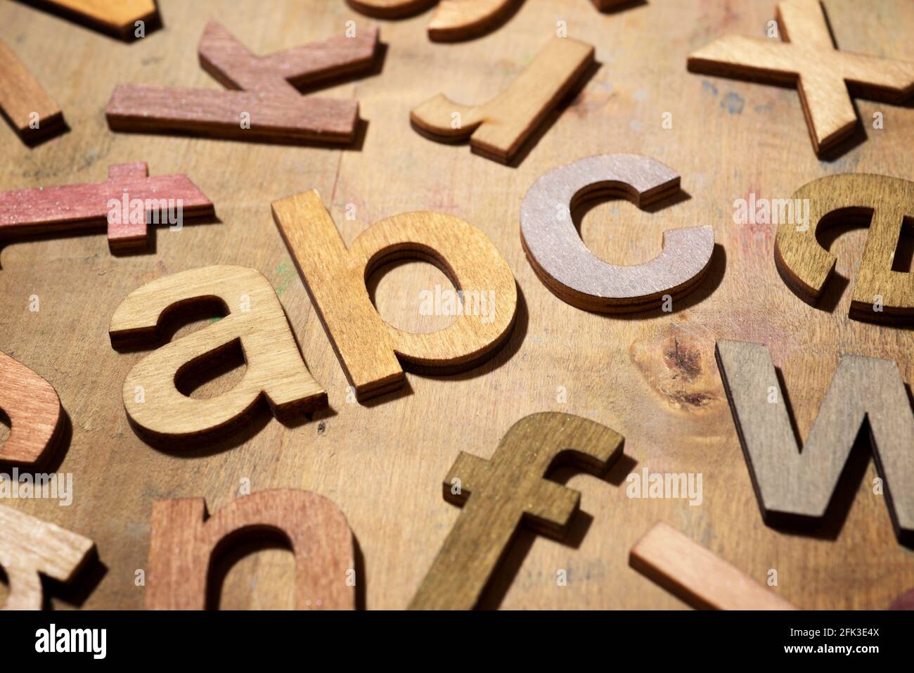 Wood letters on a wood table Stock Photo - Alamy