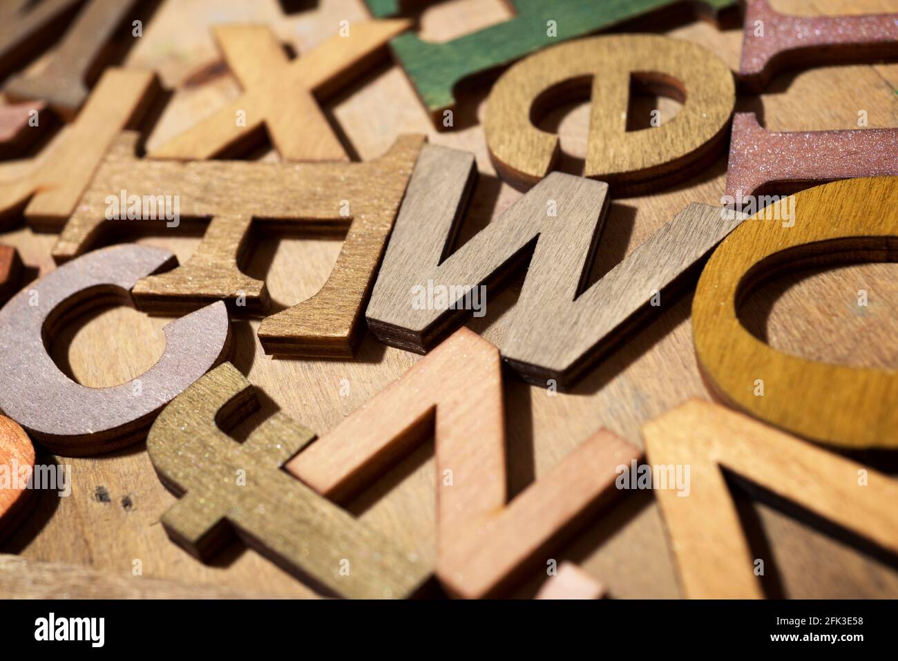 Wood letters on a wood table Stock Photo - Alamy