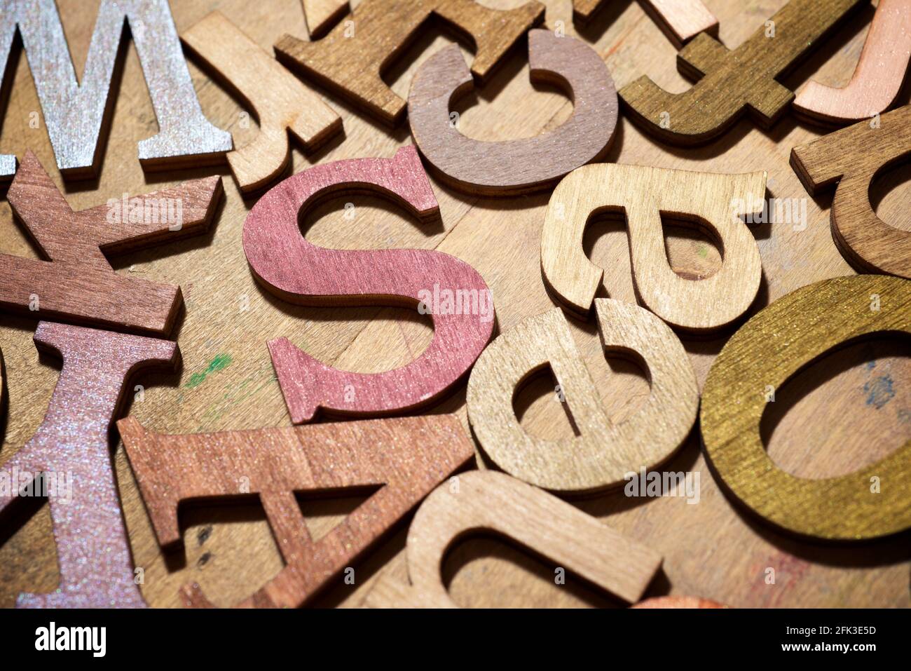 Wood letters on a wood table Stock Photo - Alamy