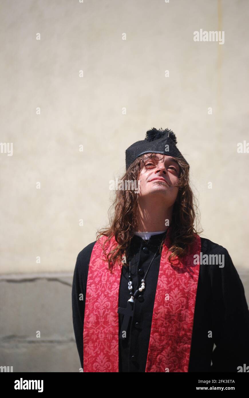 Catholic priest with long hair. Photo taken in Florence during the ...